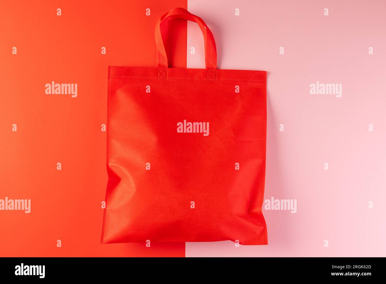 Red canvas bag with copy space on pink and red background Stock Photo ...