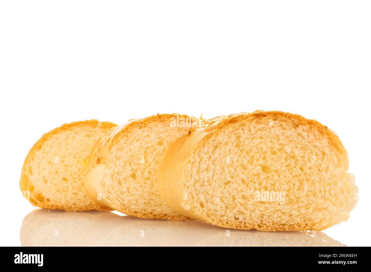 Three slices of fragrant bun sprinkled with sesame seeds, close-up ...