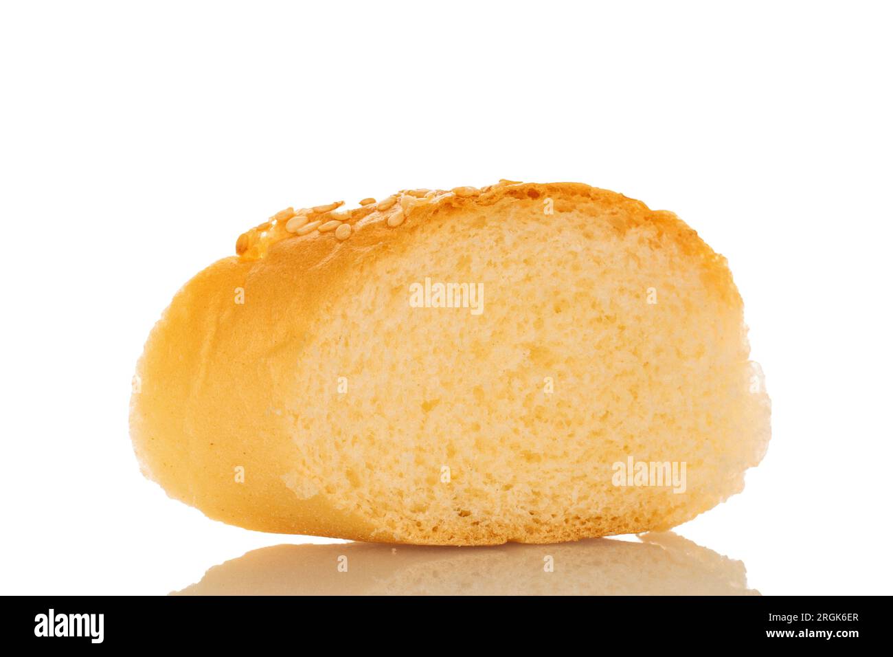 One slice of fragrant bun sprinkled with sesame seeds, close-up ...