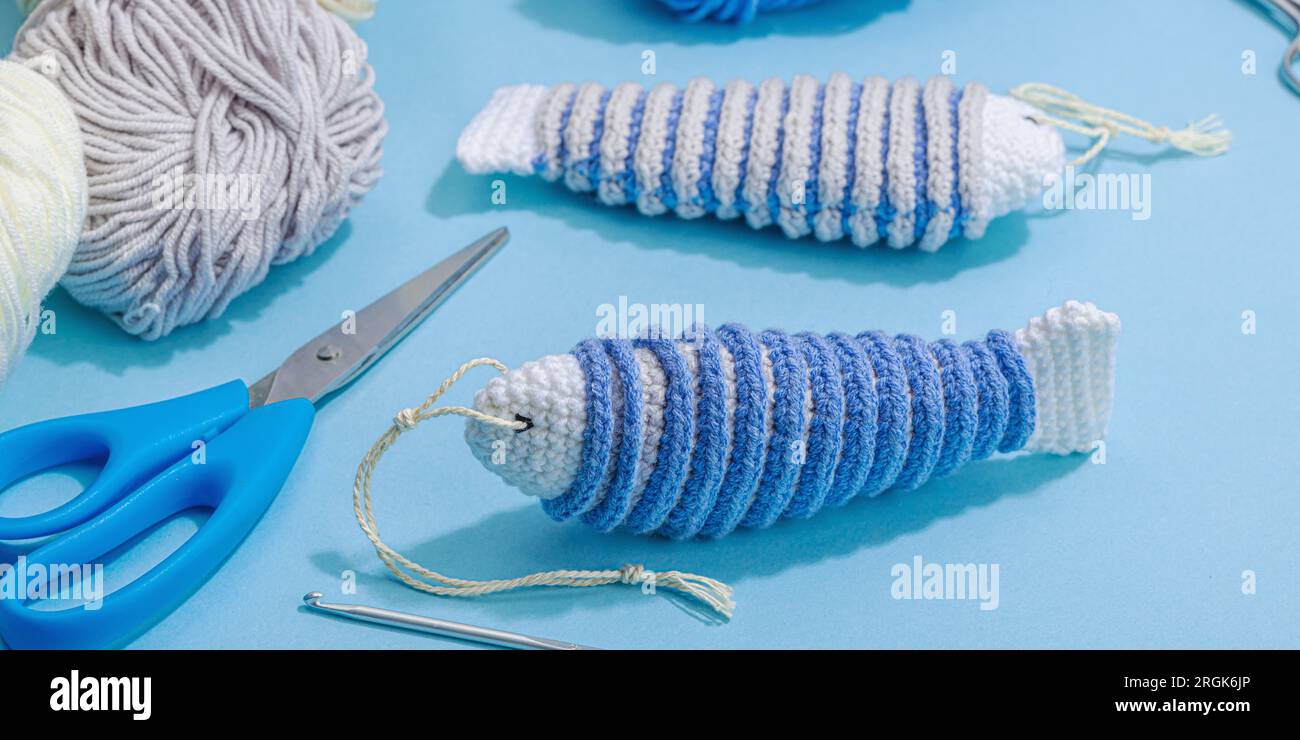 Handmade marine concept. Crocheted sardine fishes, nautical style ...