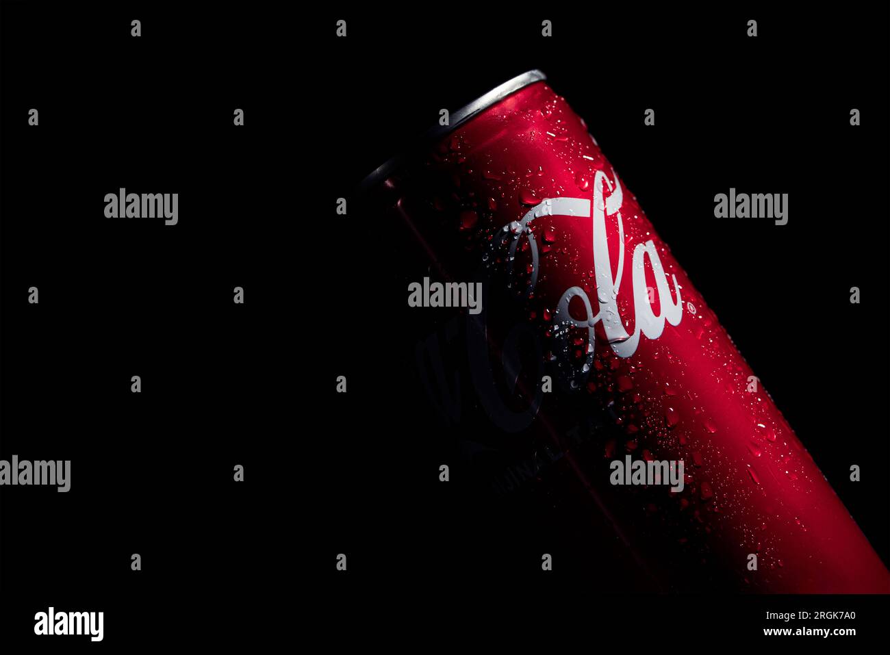 The Coca Cola drink on a black background, details, close up, editorial ...