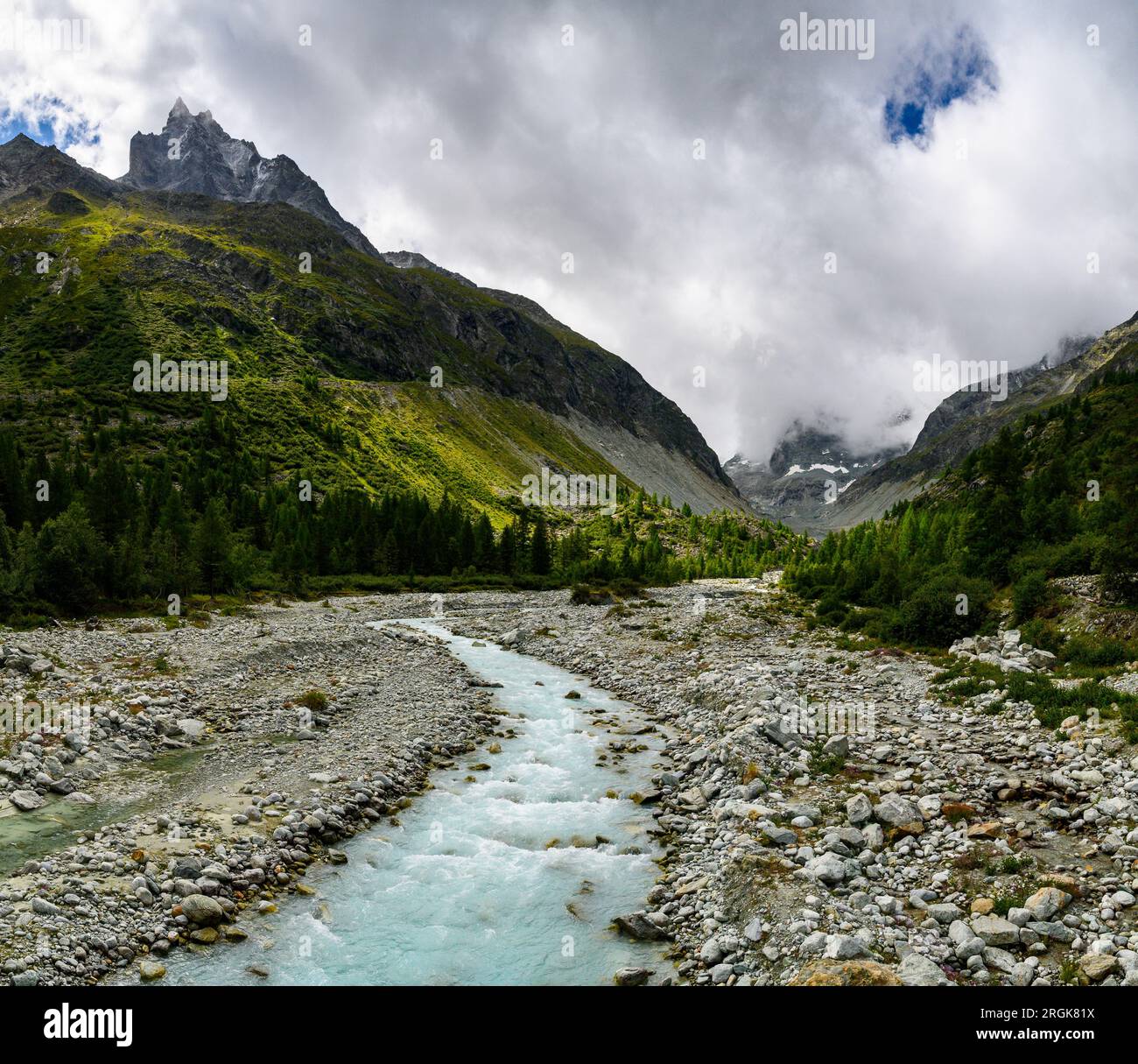 river bed of Navisence in Val d'Anniviers with peak of Le Besso, Valais ...