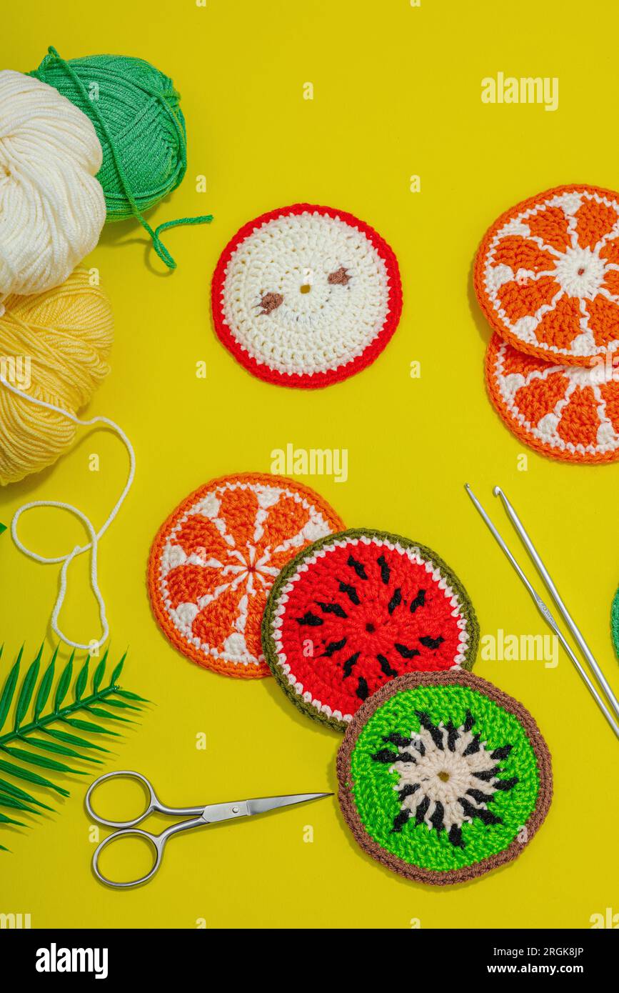 Handmade summer background. Slices of crocheted fruits, traditional ...