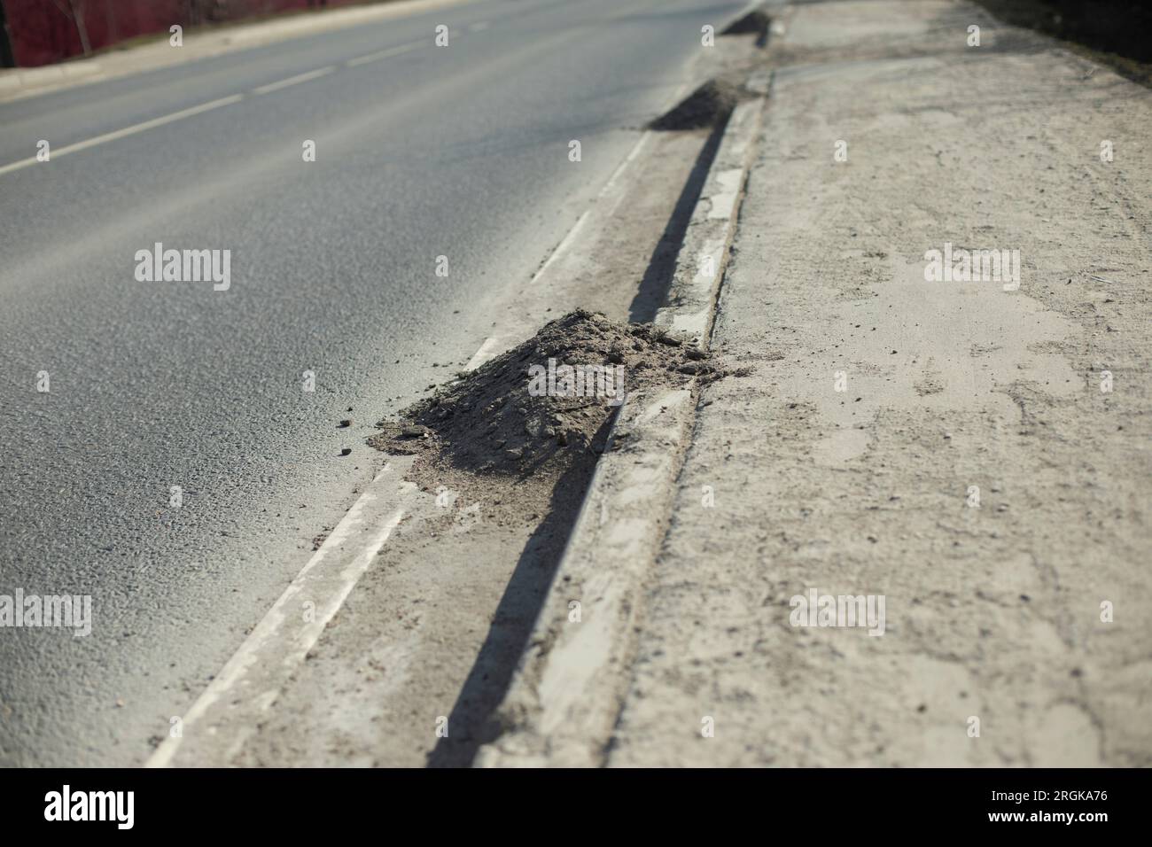 Dust on road. Pile of garbage on side of road. Cleaning track. Dirt on ...