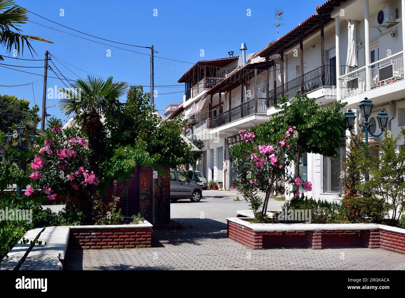 Greece, Kassandra peninsula in Halkidiki, pedestrian zone with green ...