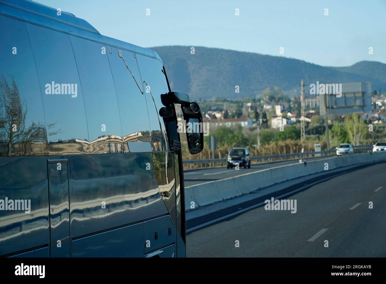 Tourist bus on a highway - side view Stock Photo - Alamy