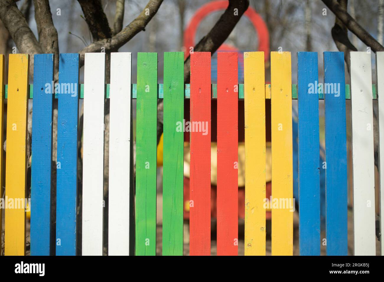 Colored fence in garden. Children's fence. Colorful board. Fun yard ...