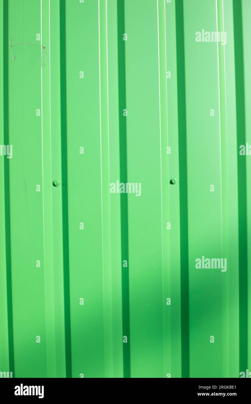 Green wall. Steel profile. Ribbed surface. Texture of fence Stock Photo ...