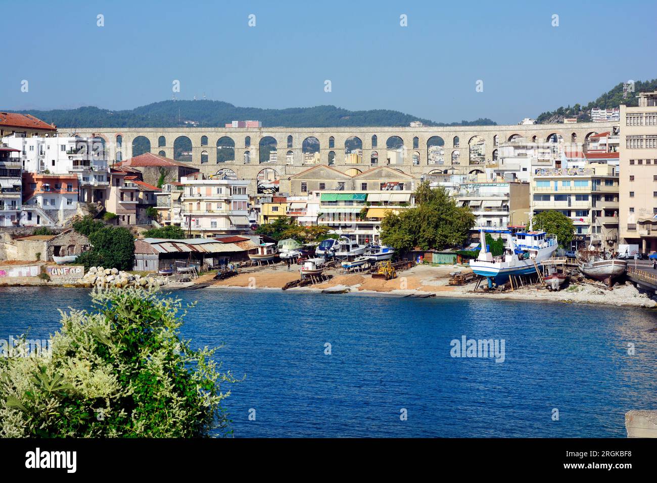 Greece, Kavala, medieval aqueduct Kamares, wharf and buildings around ...