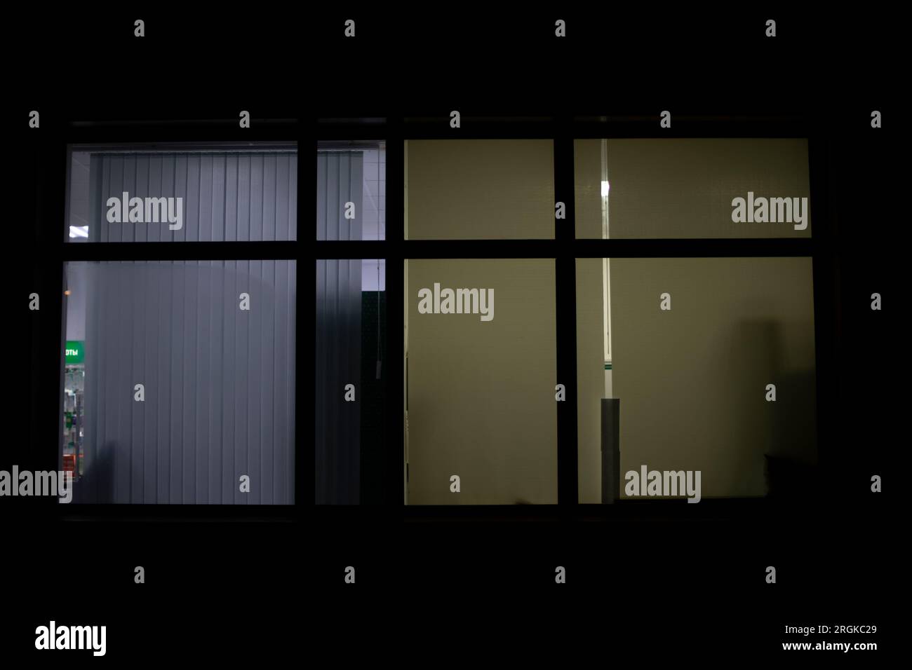 Window in building at night. Window in house. Light from office ...
