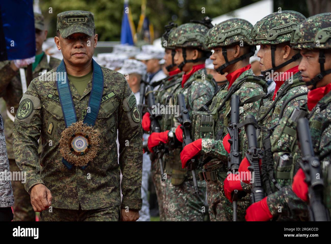 Armed Forces of the Philippines Chief of Staff General Romeo Brawner Jr. walks past honor guards ...