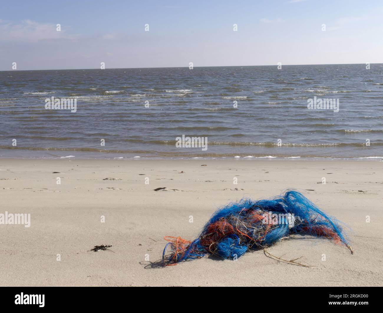 Trash on the beach. garbage, waste on the soft sand beach in beautiful ...