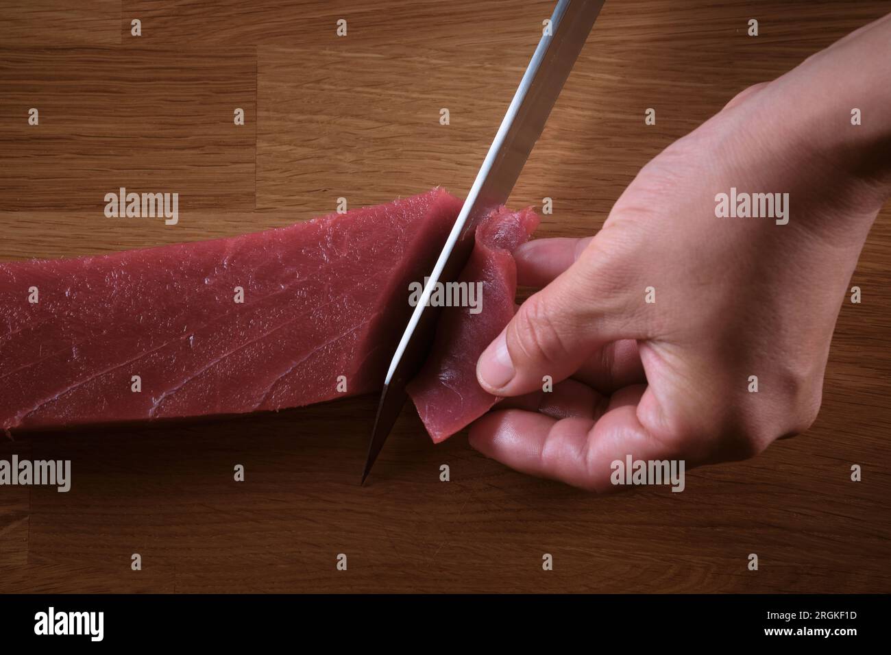 Hands slicing fish close up hi-res stock photography and images - Alamy