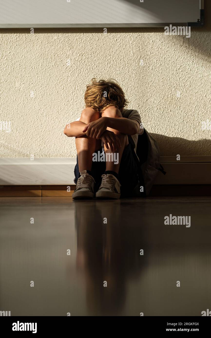 Anonymous schoolboy sad hi-res stock photography and images - Alamy