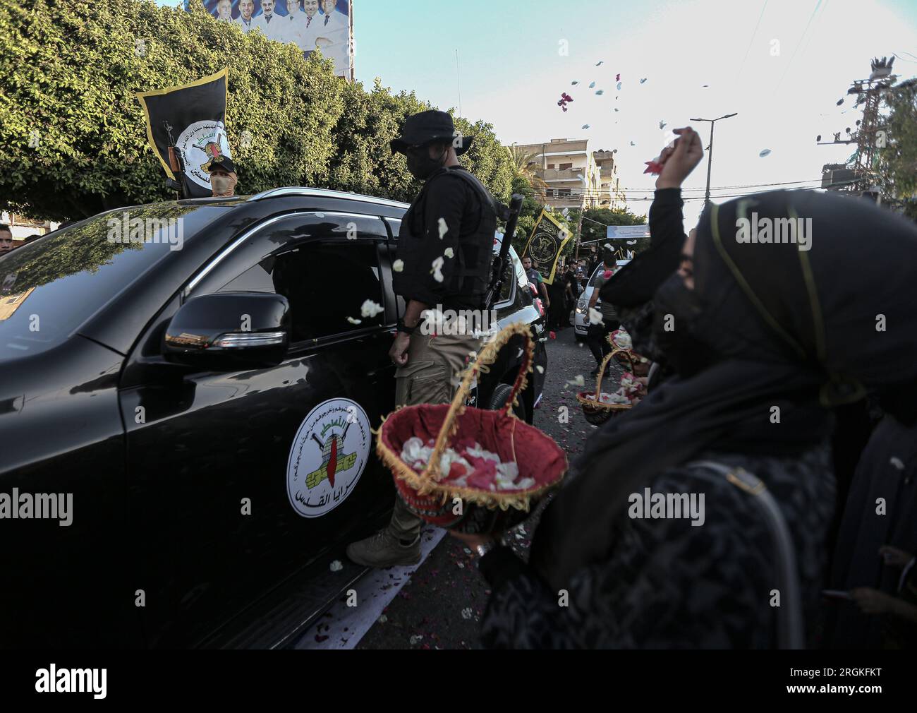 Gaza, Palestine. 09th Aug, 2023. A Palestinian woman throws roses at ...