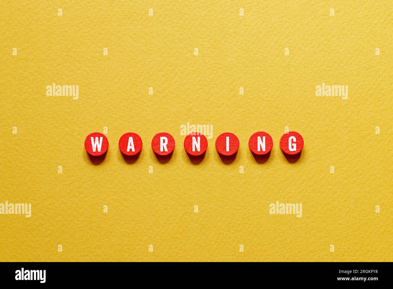 Warning - word concept on building blocks, text Stock Photo - Alamy