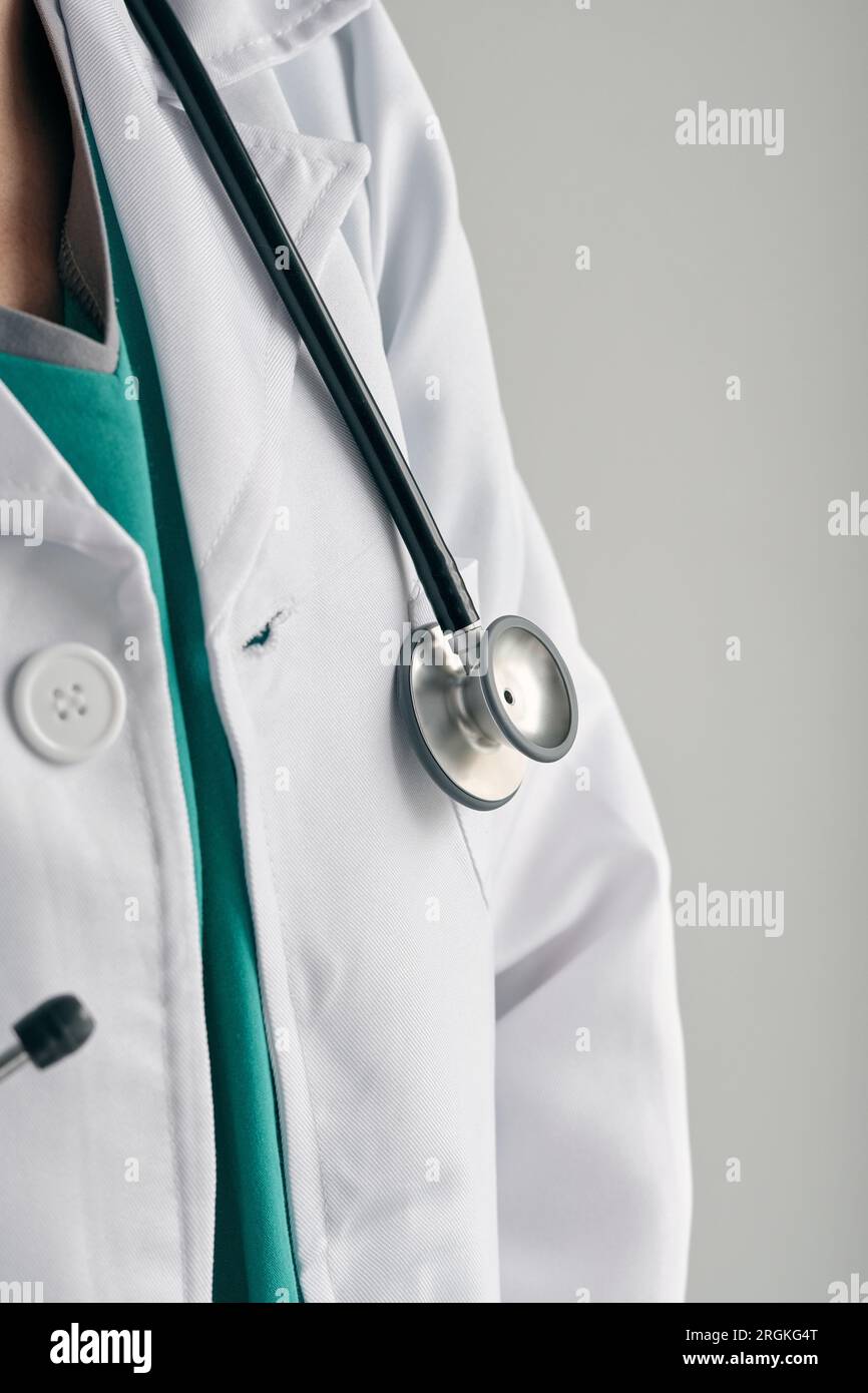 Crop anonymous doctor in white medical uniform with professional ...