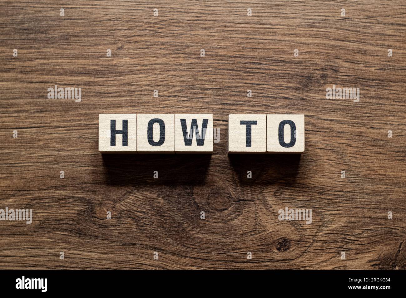How to - word concept on building blocks, text Stock Photo - Alamy