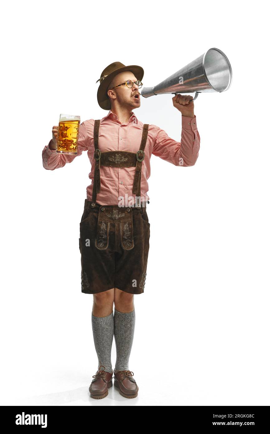 Full lenght portrait man wearing traditional Bavarian or German outfit ...