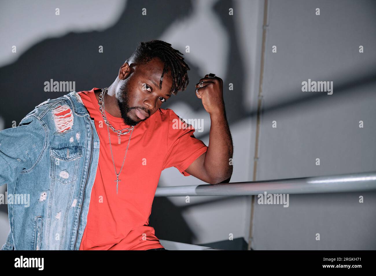 Confident black male model with dreadlocks wearing trendy outfit ...