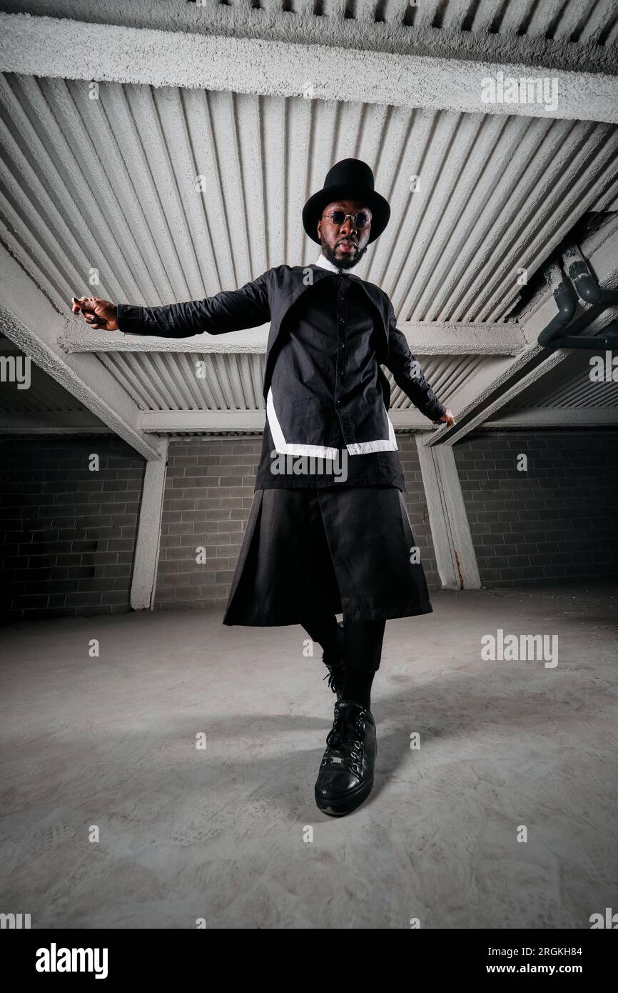 Low angle full body of African American male hip hop dancer in ...