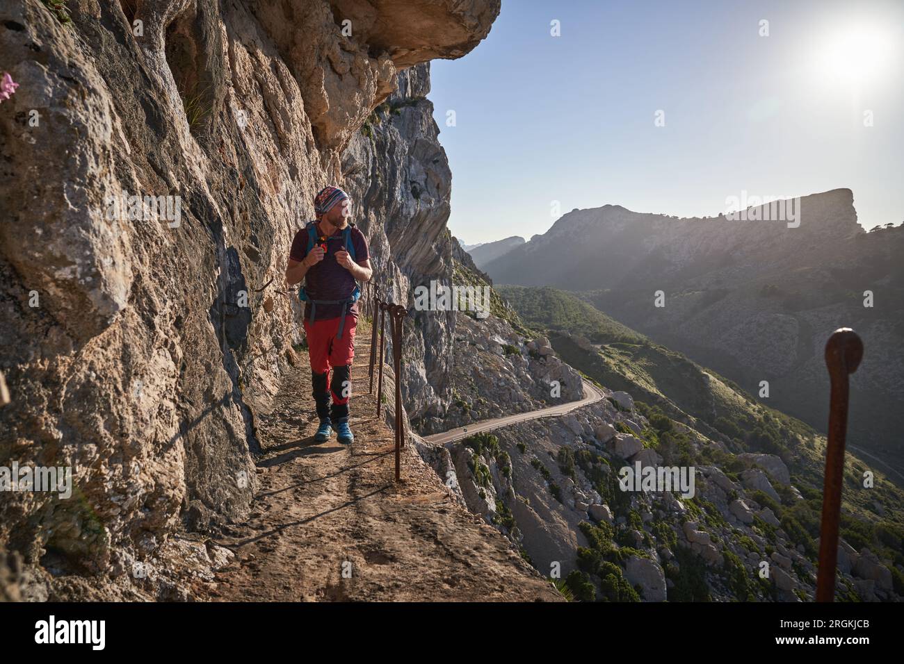 Man walking along narrow rocky hi-res stock photography and images - Alamy