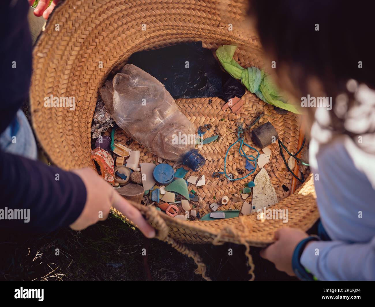 From above of crop unrecognizable preteen children observing heap of ...