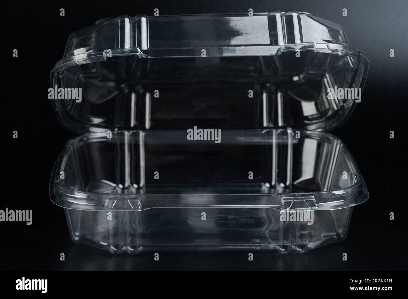 Transparent open food box front view isolated on black background Stock ...