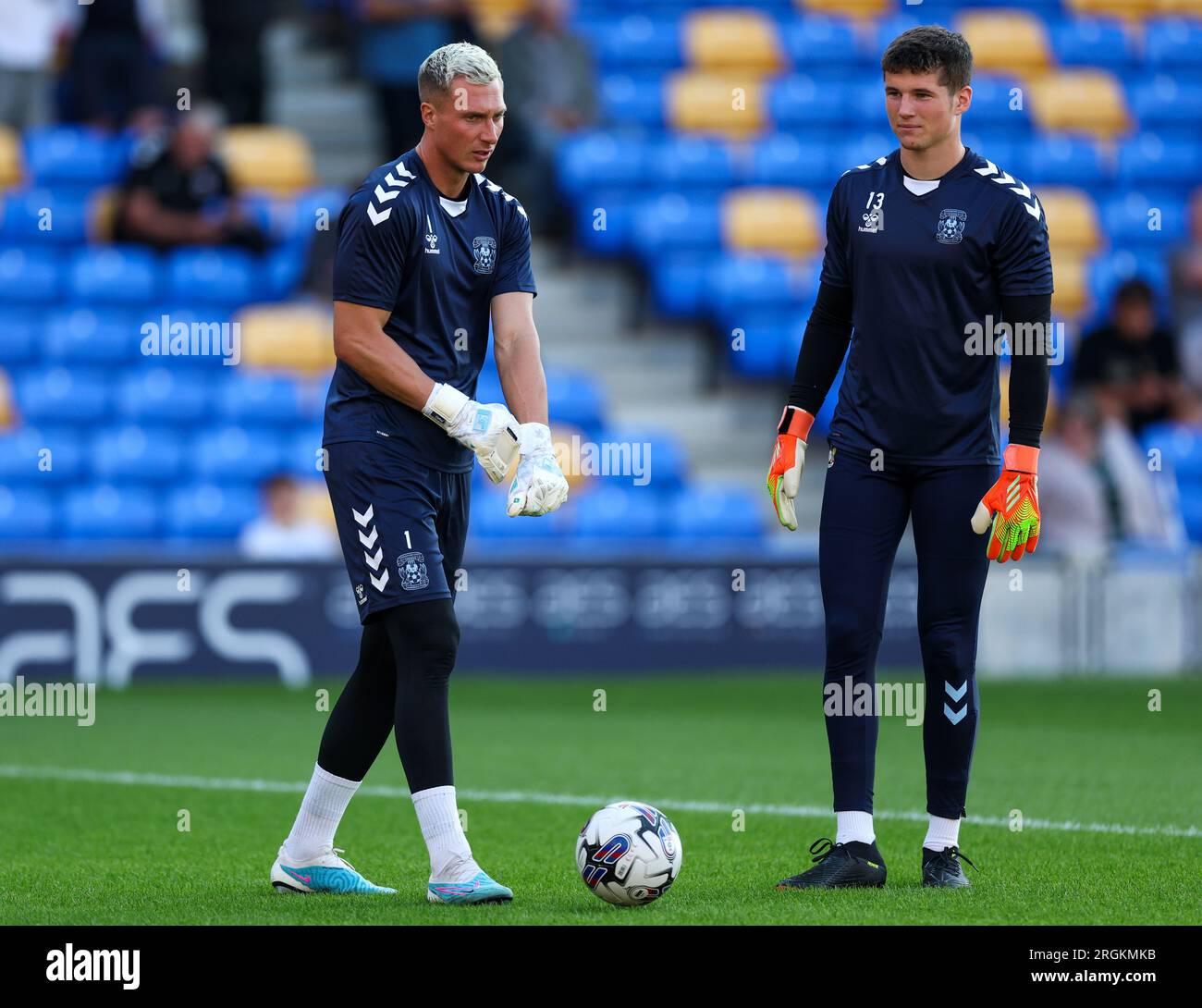 Coventry City goalkeeper Simon Moore and Ben Wilson in action during ...