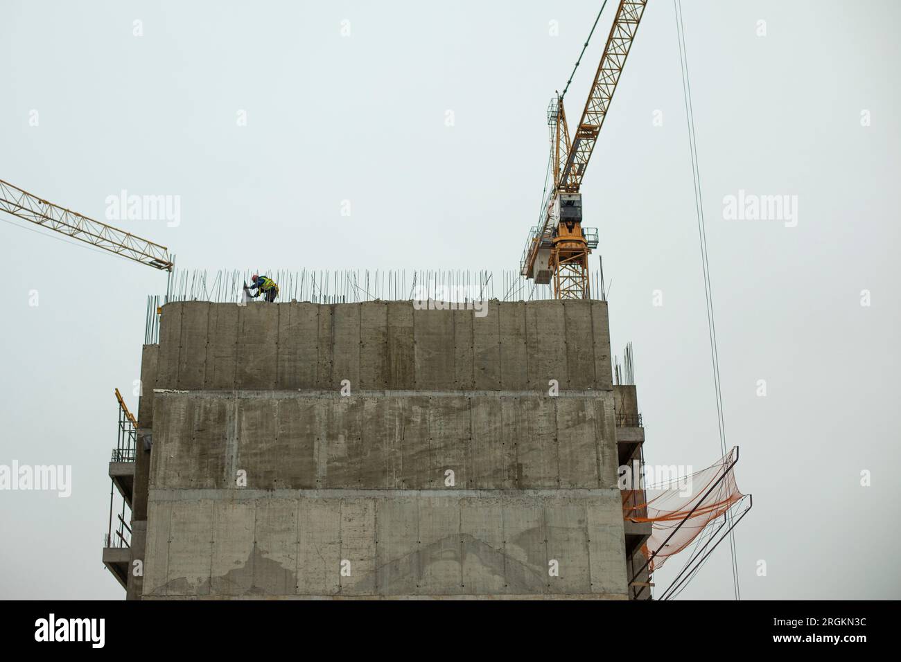 Building house. New building. Concrete frame. Construction of high-rise ...