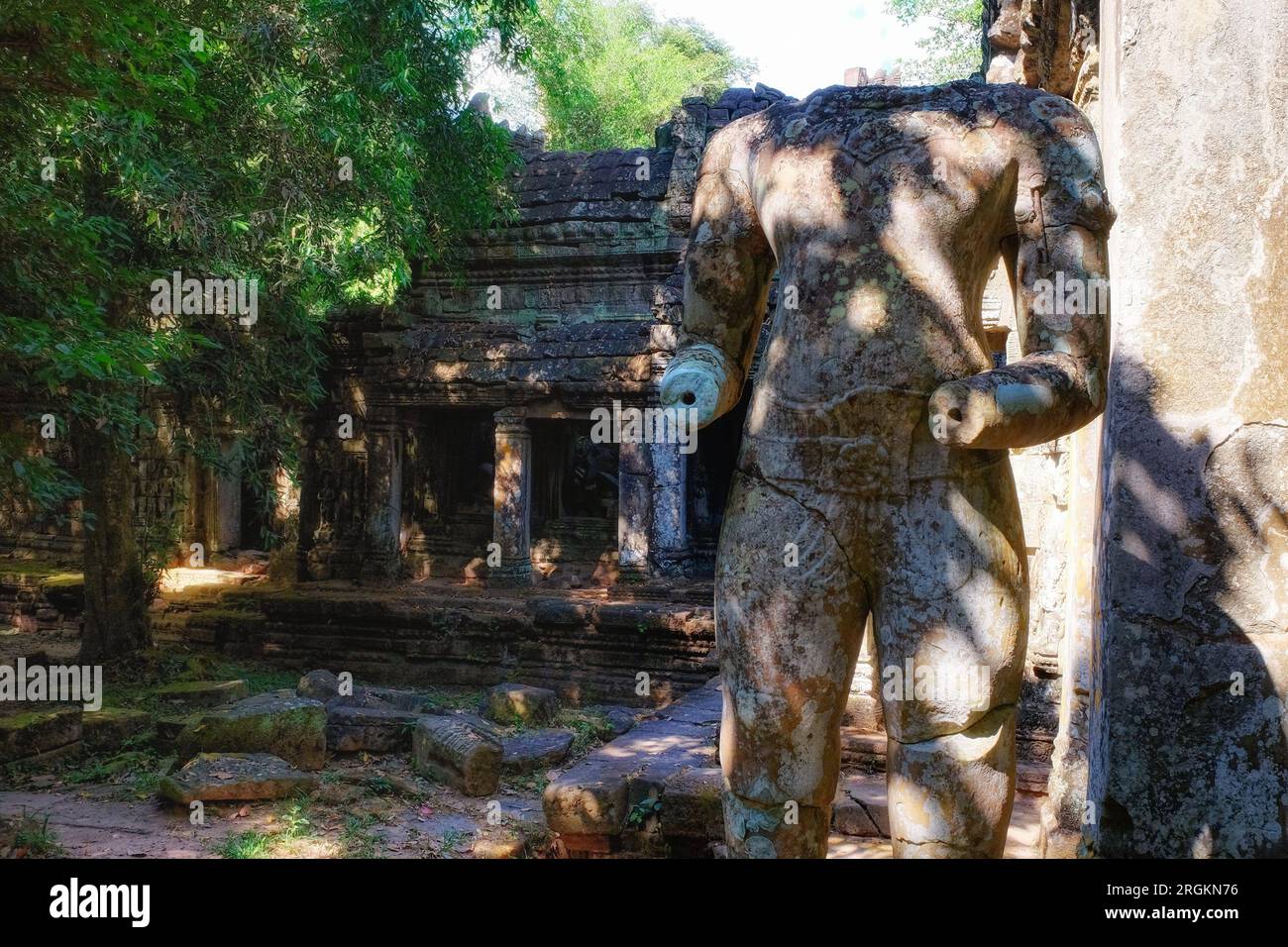 Time-worn: An ancient damaged statue near Cambodia's Khmer ruins Stock ...