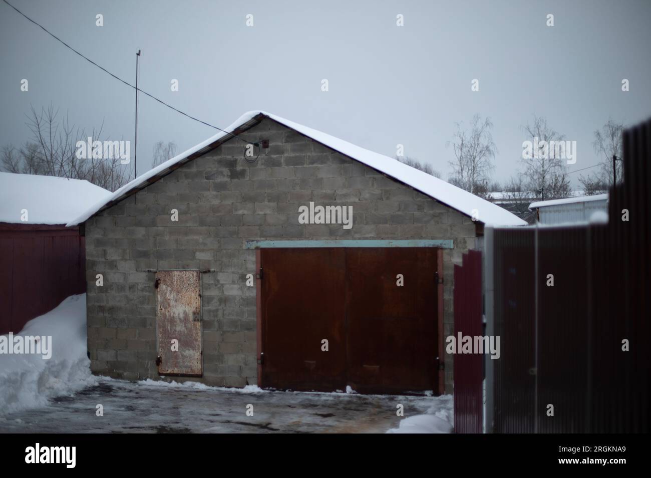 Garage for transport. Concrete house. Rusty gates. Garage block. Ridge ...