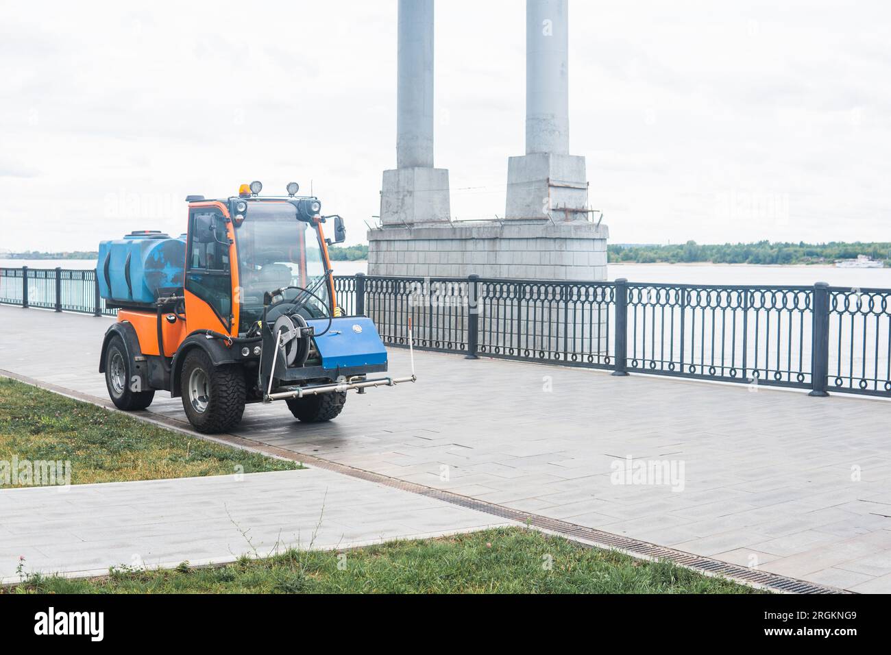 small tank truck for cleaning paths and watering plants on the city ...