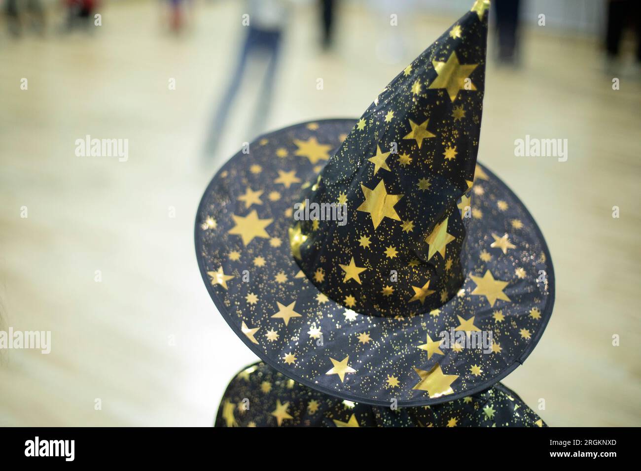 Wizard hat. Child at holiday. Cap on head. Details of children's play ...