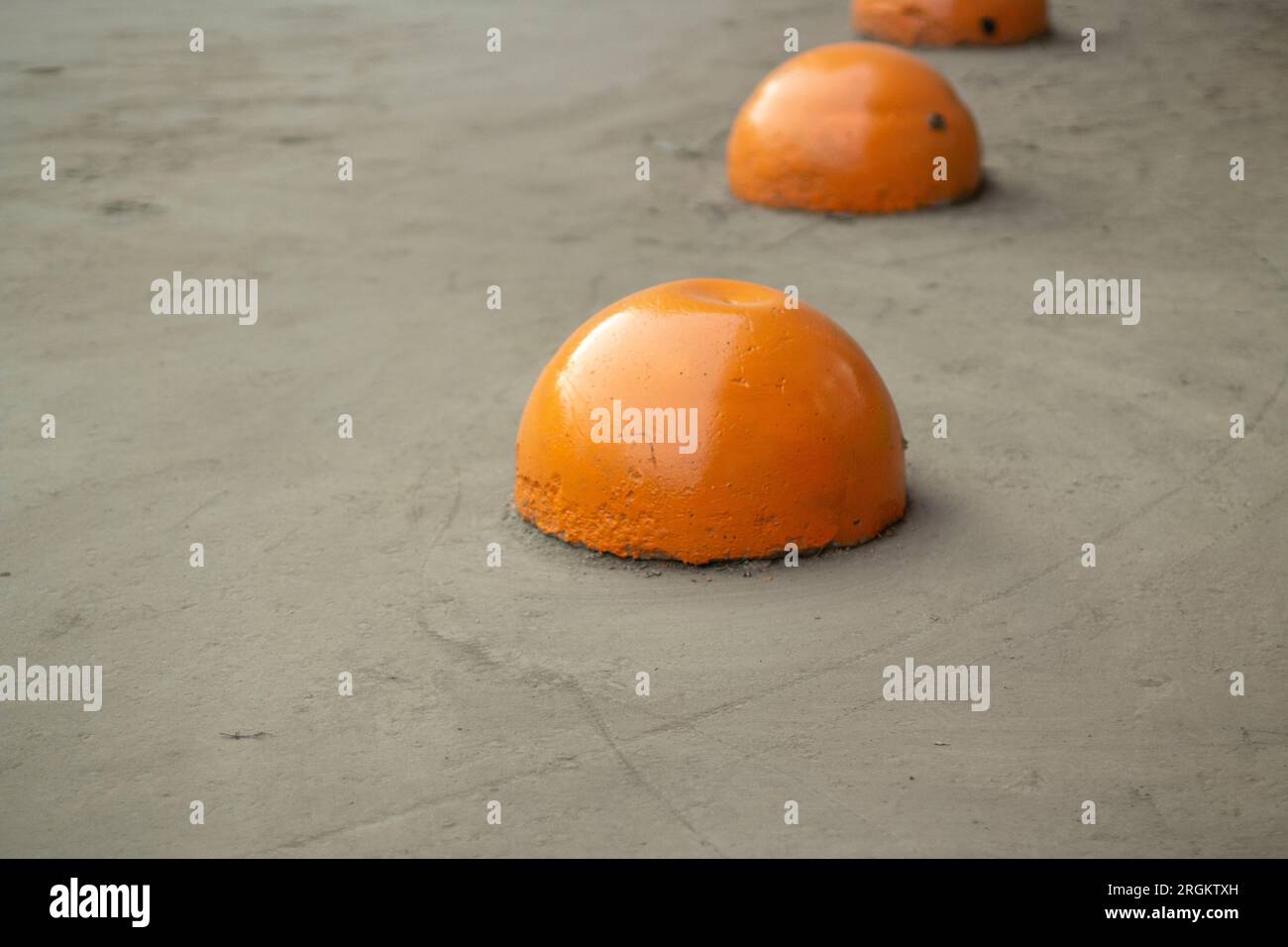 Parking areas. Orange spheres on road. Parking space closed. Motion ...