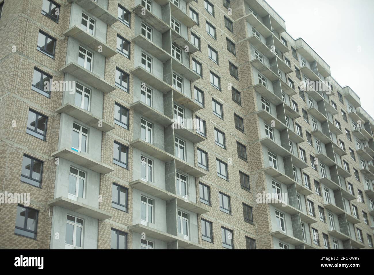 Building under construction. Windows in house. Concrete structure ... Building under construction. Windows in house. Concrete structure ...