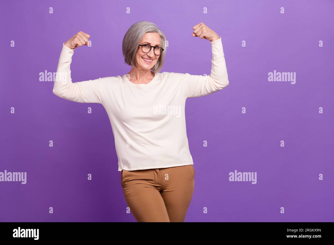 Photo of charming business lady show double biceps muscles arms fists ...