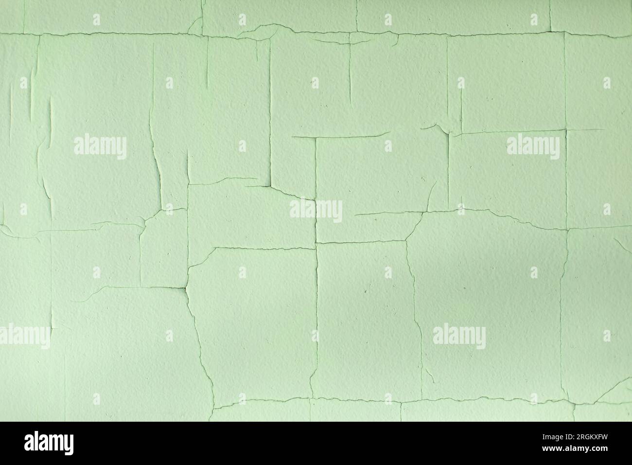 Cracks in paint. Old paint on wall. Fine mesh of cracks on surface ...
