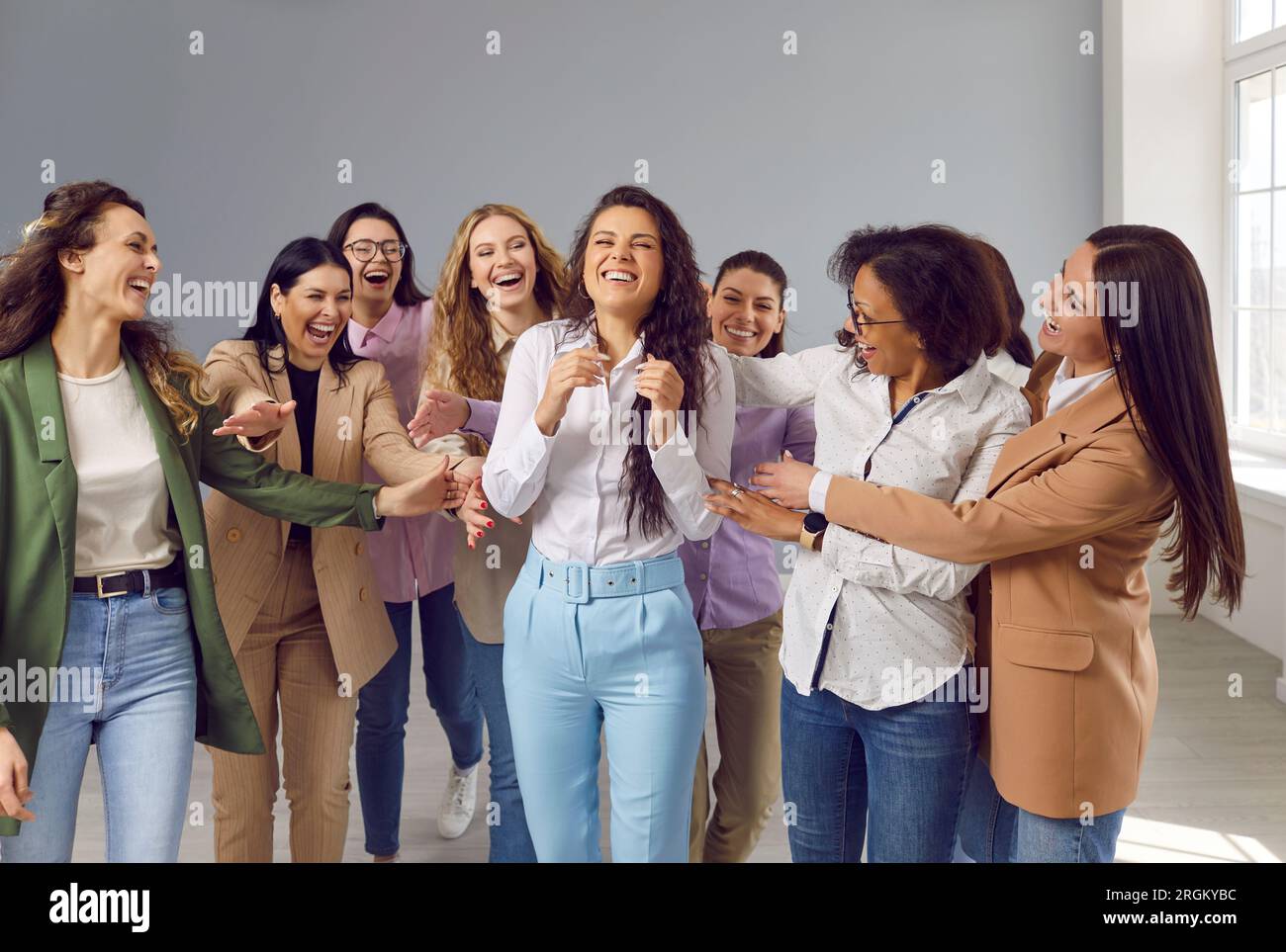 Group of happy diverse female colleagues or friends laughing together ...