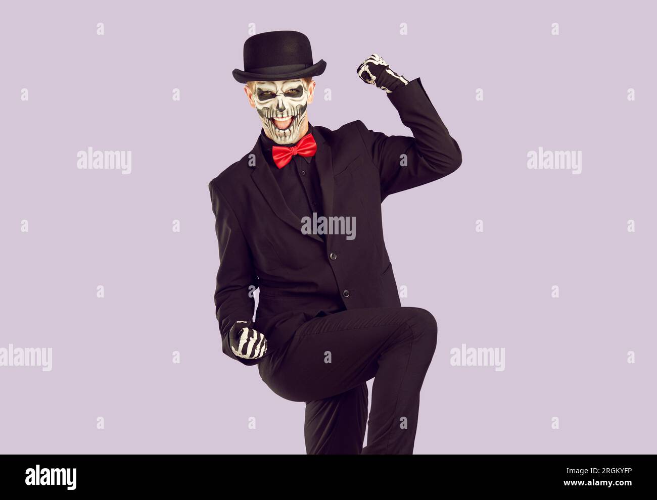 Scary excited man with skeleton makeup celebrating success Stock Photo ...