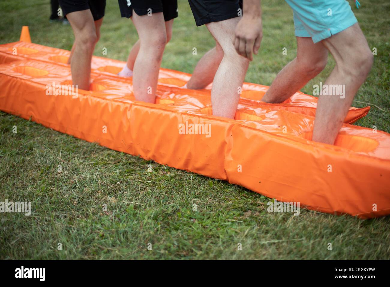 Sports game. Group competition. Orange Material. Athletes legs Stock ...