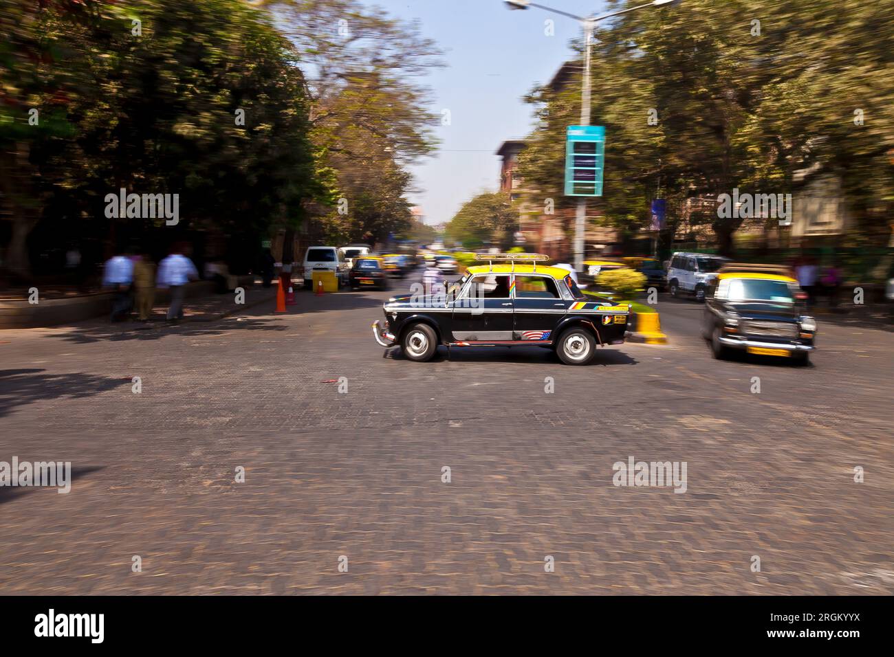 Image of a moving cab in the Indian city of Mumbai taken with motion ...
