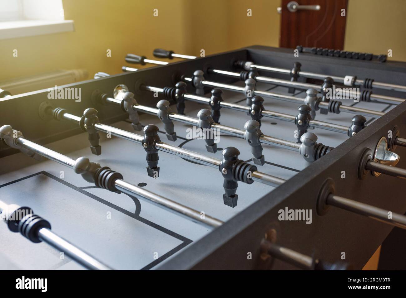 Foosball in the room close-up. Sports children's game Stock Photo - Alamy