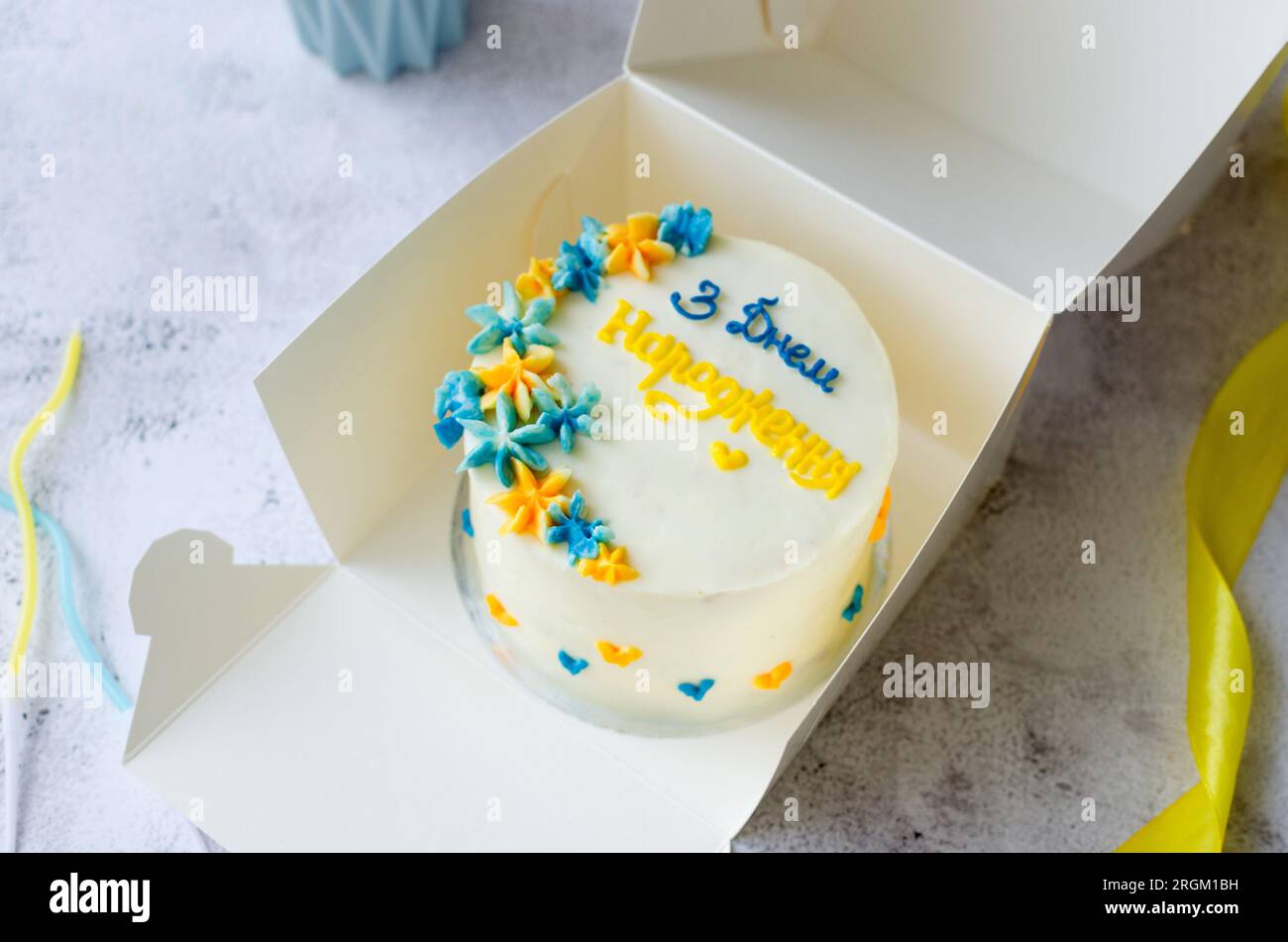 Trendy bento cake with with an blue-yellow inscription in Ukrainian ...