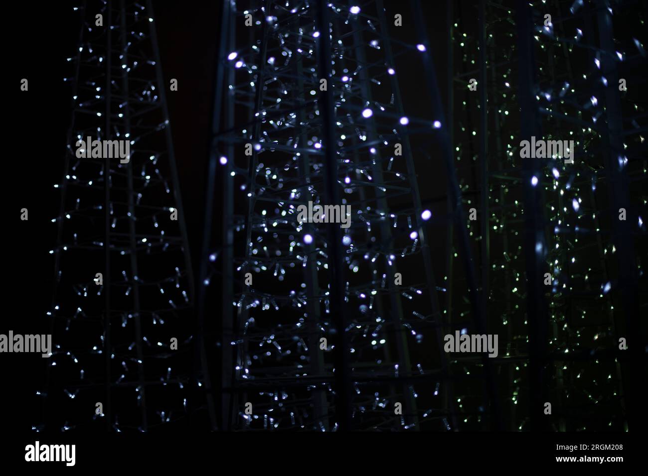 Texture from garlands. Led bulbs. White lights in dark. Glow on black ...