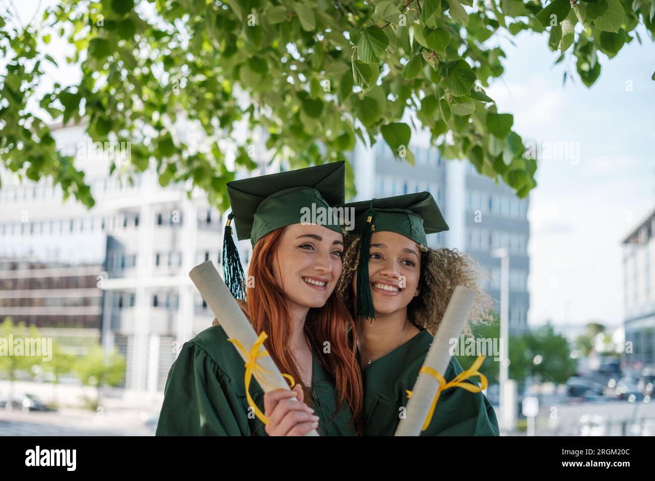 Two young women recently graduated from the university showing their ...