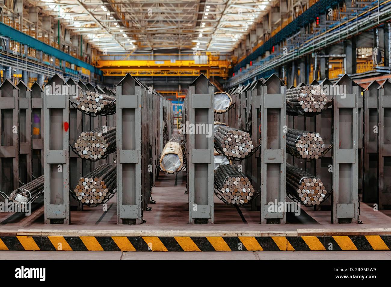 Packs of rolled metal bars on the shelves Stock Photo - Alamy