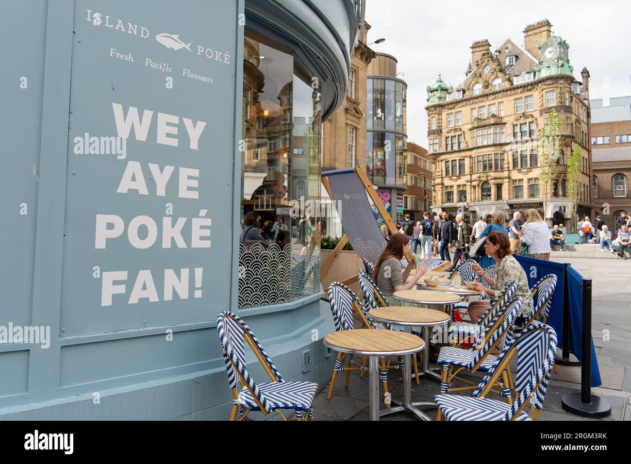 A sign outside of the Island Poke cafe reads, 'Wey Aye Poke Fan!' in ...