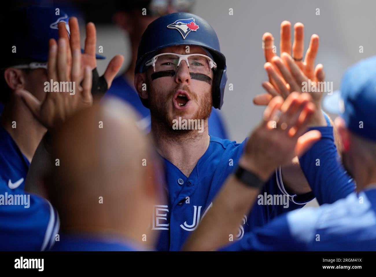 Toronto Blue Jays' Danny Jansen celebrates in the dugout after scoring ...