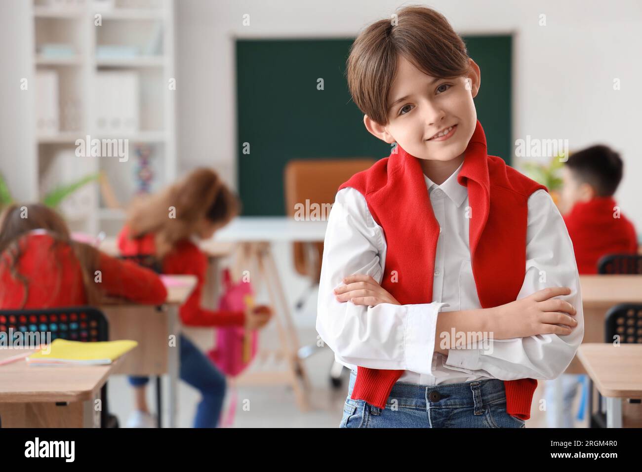 Little schoolboy in classroom Stock Photo - Alamy